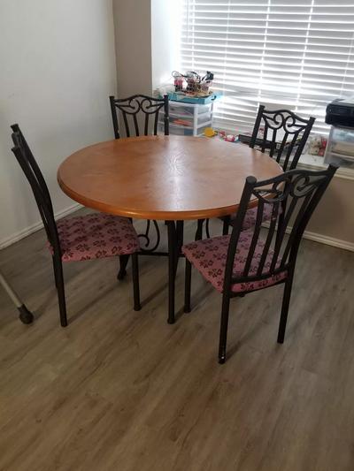 Wrought iron kitchen table and 4 chairs. No damage, has a little paint ...