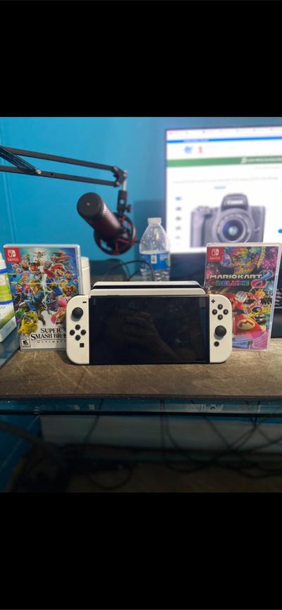 Nintendo Switch OLED with Mario Kart and Super Smash Bros for sale in ...