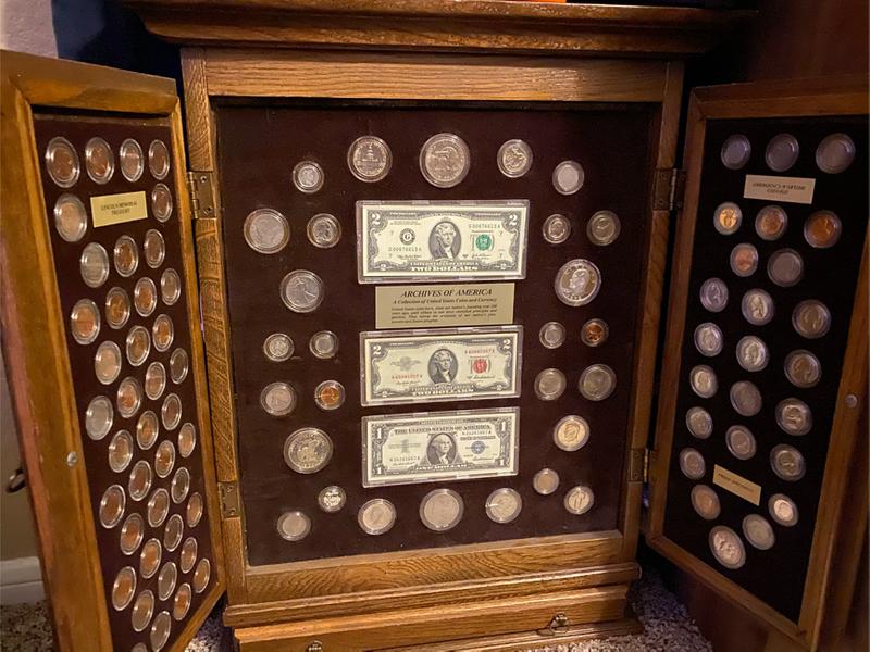 Collectible coin in cabinet what’s a very nice wooden display case ...
