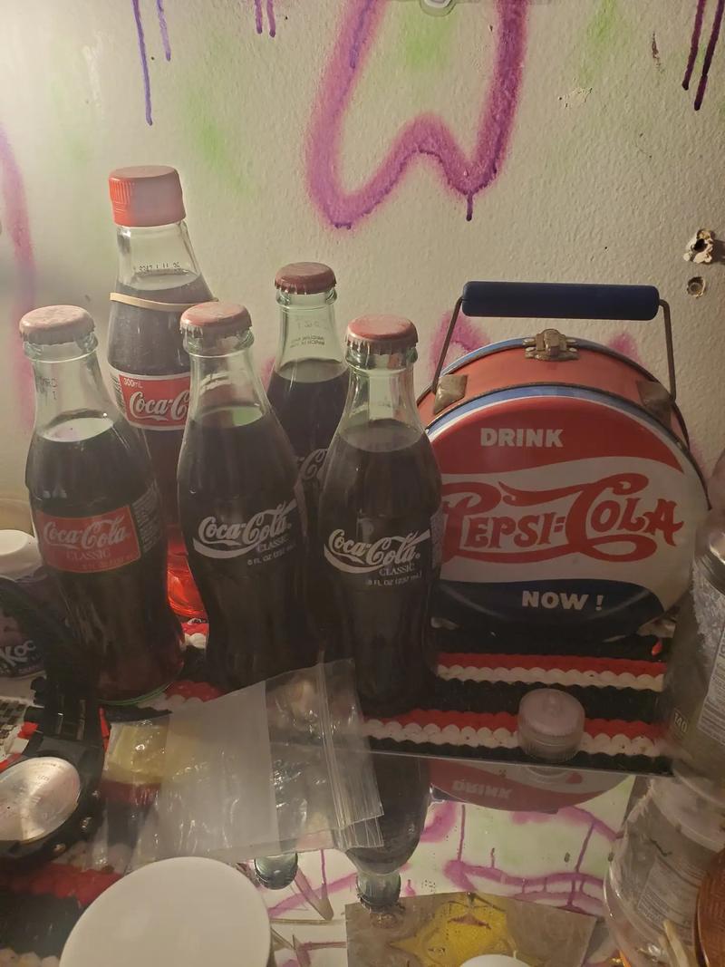 5 coca cola bottles full from late 80s early 90s and a Pepsi cola ...